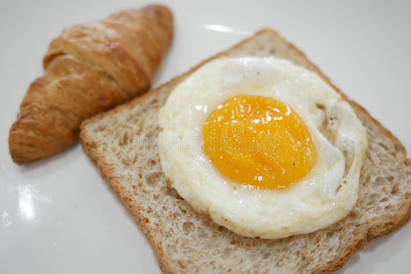 Half Boiled Egg, Toasted Bread and Tea on Table Stock Image - Image of ...