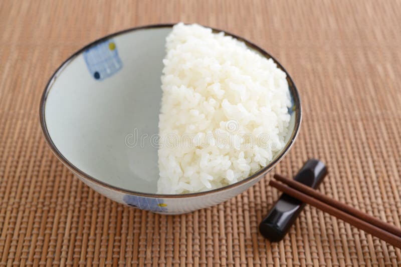 Half a bowl of rice. stock photo. Image of diet, isolated - 143220504