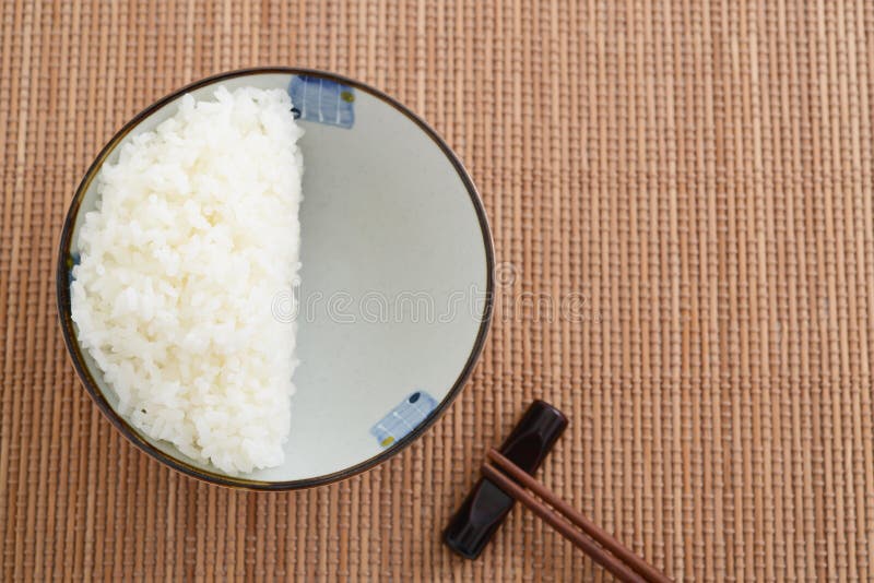 Half a bowl of rice. stock image. Image of dinner, isolation - 143220921