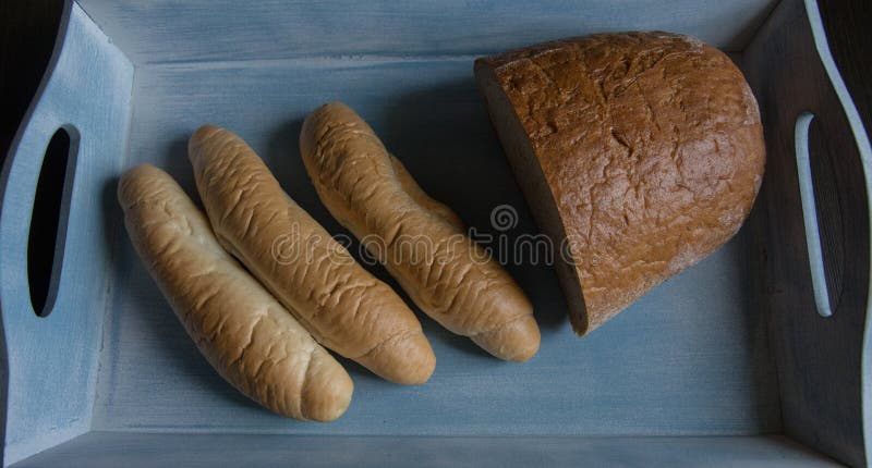 Half Bread and Rolls on the Blue Wood Plate Stock Image - Image of oven ...
