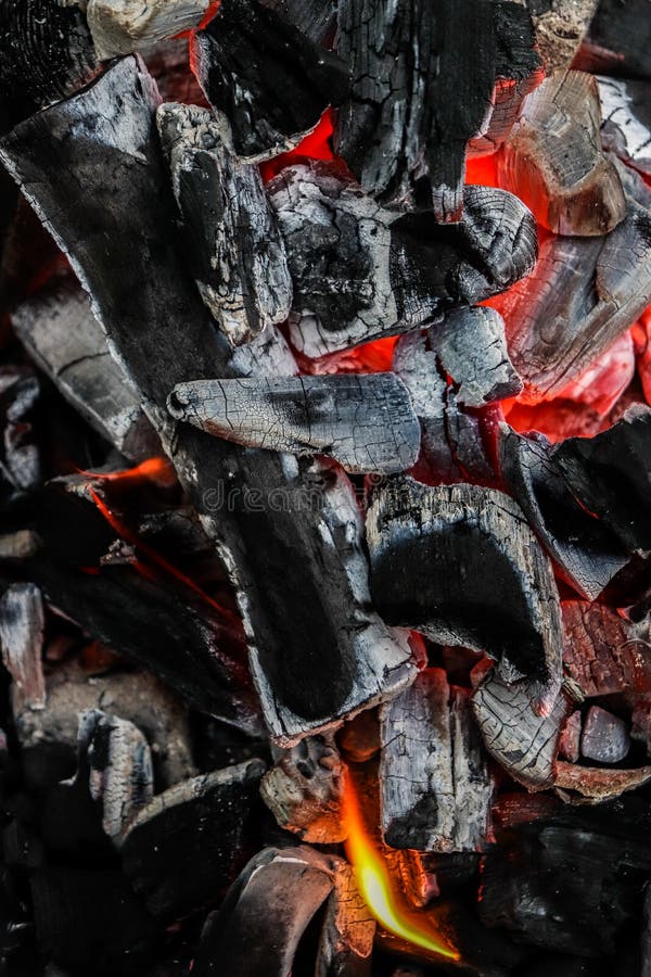 Half burned coal close up stock image. Image of burned - 146053611