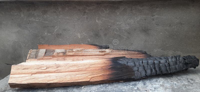 Half Burned Wood Log on Concrete Floor Stock Image - Image of wood ...