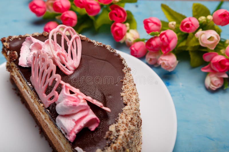 Half of Cake on White Plate on Blue Painted Background. Sweet Bakery ...