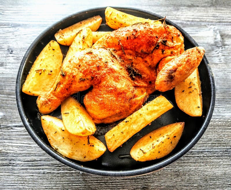 Half Chicken Roasted with Potato Wedges on Plate Stock Photo - Image of ...