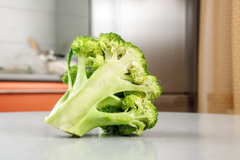 Cut in a Half Broccoli in the Kitchen Environment Stock Photo - Image ...