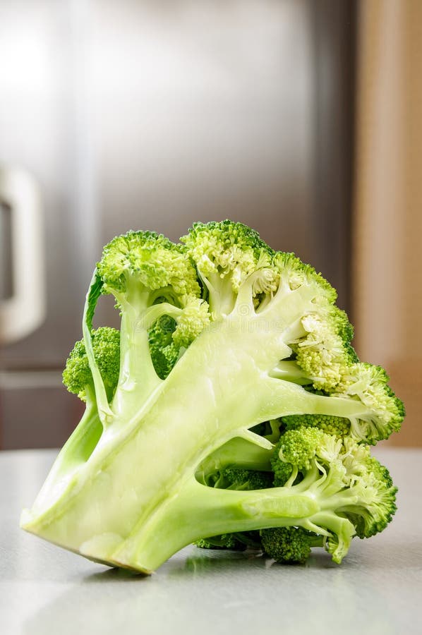 Cut in a Half Broccoli on the Grey Table Stock Image - Image of macro ...