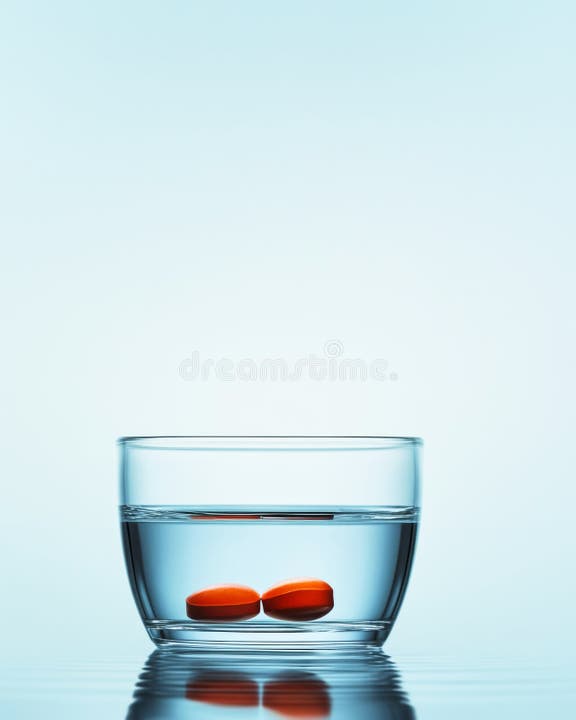 Half-dissolved Tablet Floating in Clear Water Creates an Abstract ...