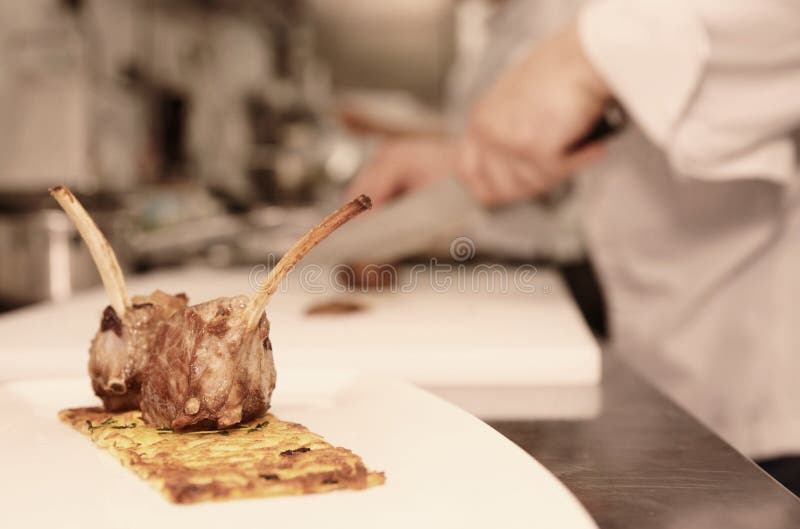 Half Done Meat Dish with Chef in Background Stock Image - Image of ...