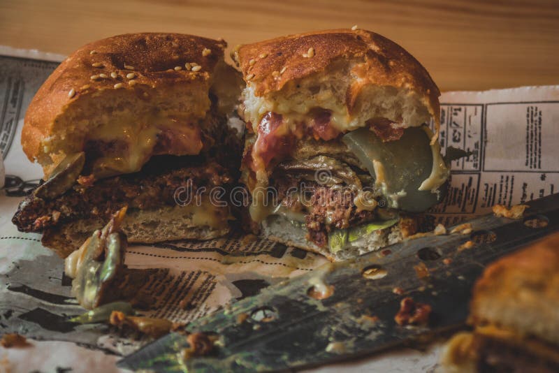 A Half-eaten Burger on a Table in a Cafe. Stock Image - Image of ...