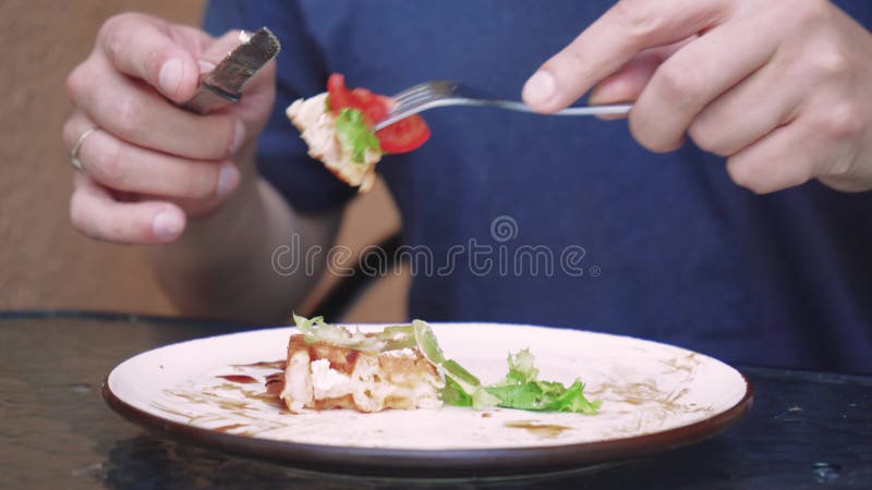 A Half-empty Plate with Leftover Food, Which a Man Eats with Great ...