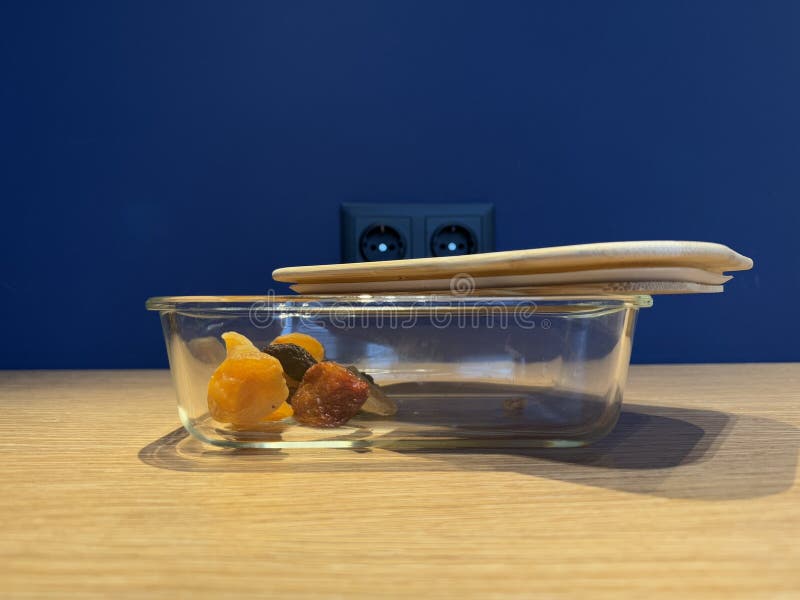Half Empty Transparent Container with Dried Fruits Stock Image - Image ...