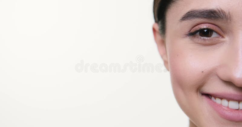 Half face of smiling woman stock footage. Video of indoor - 211938390