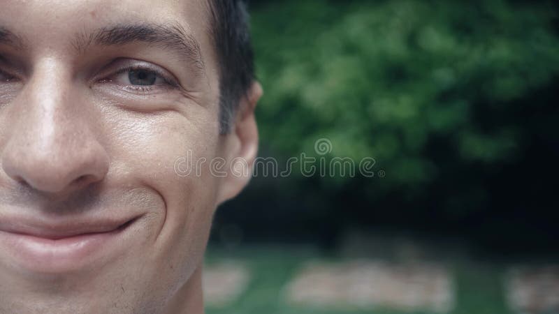 Half Face Portarit of Young Man Outdoor. he is Looking in Camera. Stock ...