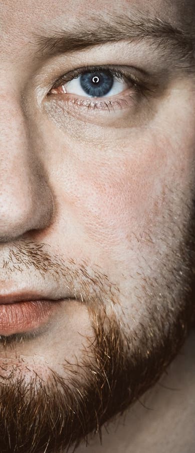 Half Face of a Young Man with a Red Beard Looking at the Camera Stock ...