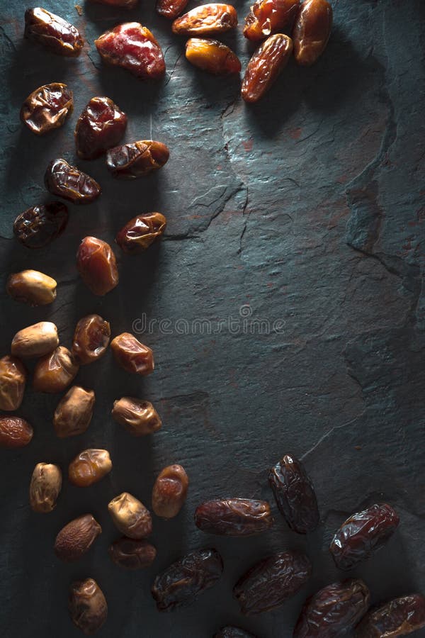 Half-frame of Dried Dates on a Gray Blue Table Stock Photo - Image of ...