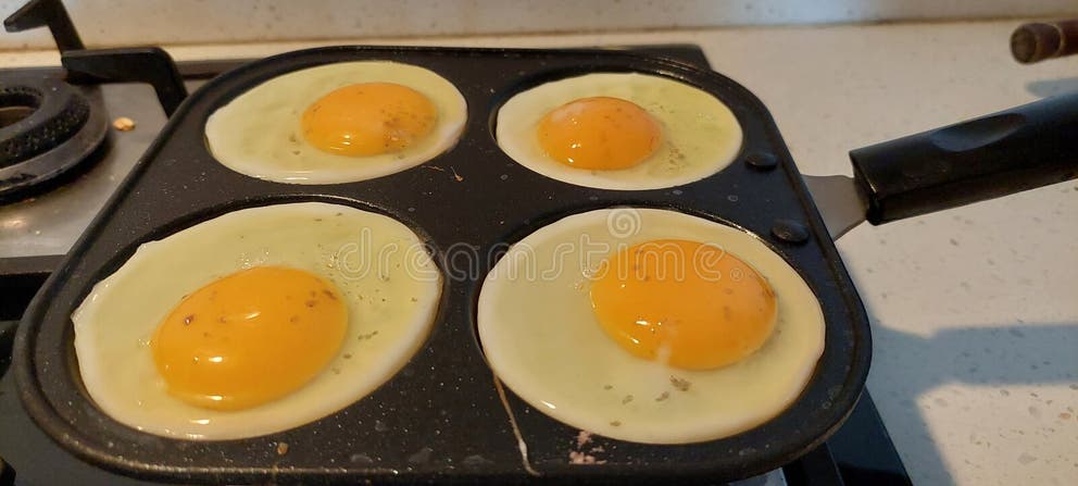 Half Fried Egg in a Non- Stick Pan (side View) Stock Photo - Image of ...