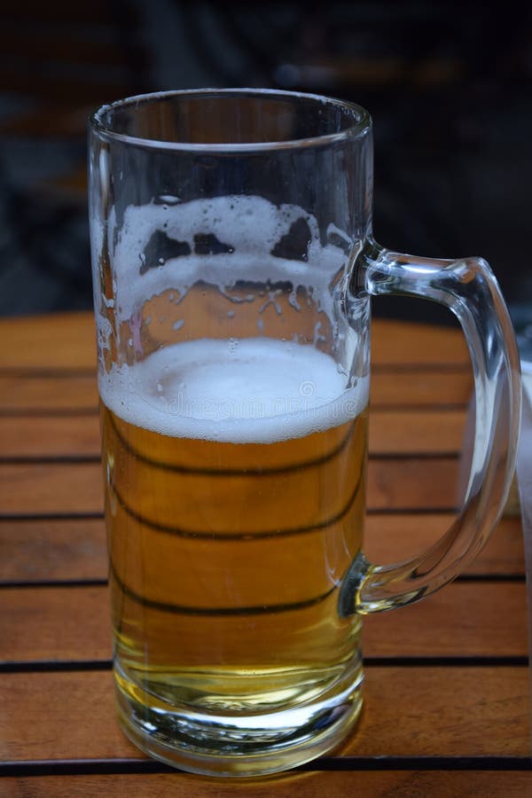 Half full mug of beer. stock image. Image of white, yellow - 255980969
