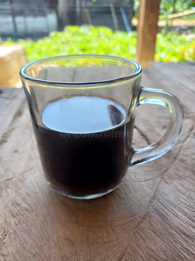 Half Glass of Black Coffee on Wood Stock Image - Image of black, coffee ...