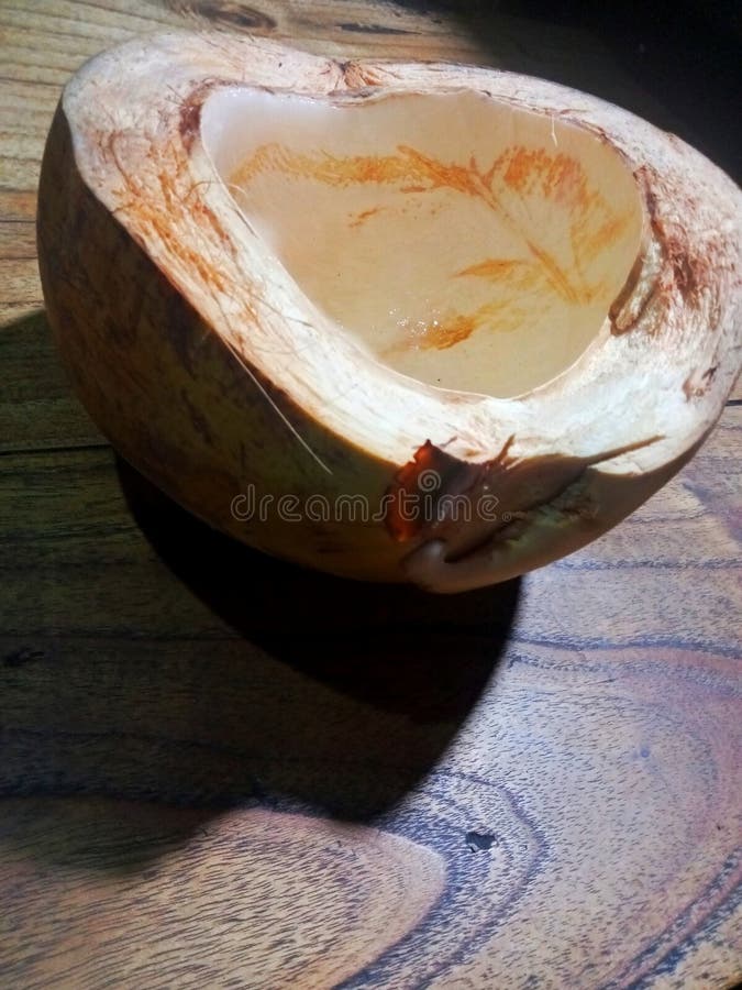 Half Green Young Coconut at the Table Stock Photo - Image of table ...