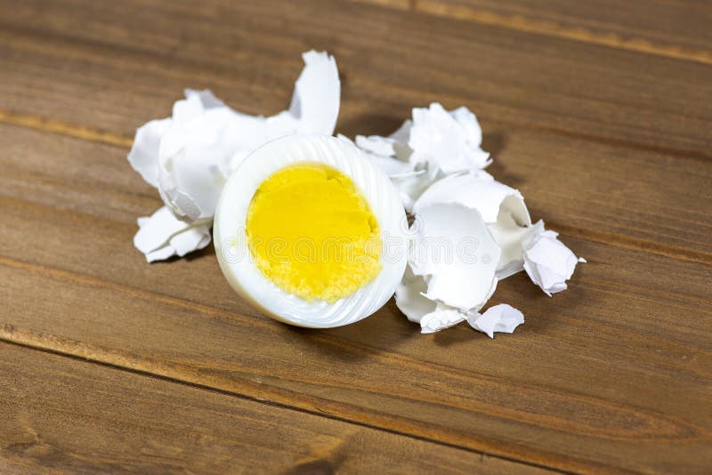 Half a Hardboiled Egg with the Shells Laying on the Kitchen Table Stock ...
