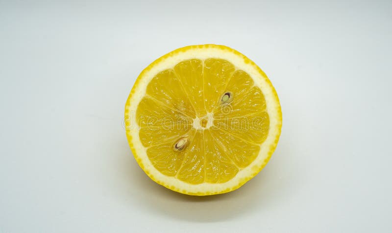 A Half Cut Lemon on a Table with Its Skin Cut Off Stock Photo - Image ...