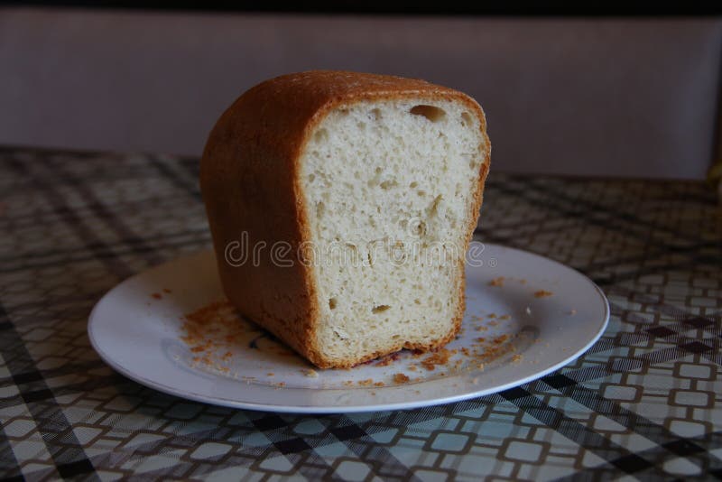 Half Loaf of Bread on a Plate Stock Photo - Image of crumbs, bread ...