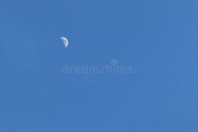 Half moon at the blue sky stock photo. Image of moon - 171329698