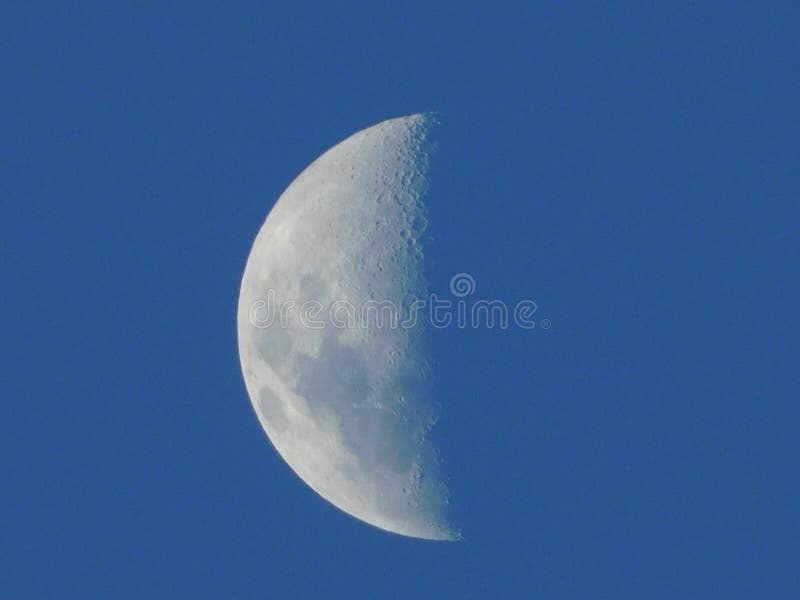 The Half Moon in the Blue Sky and the Perfect White Color Stock Photo ...