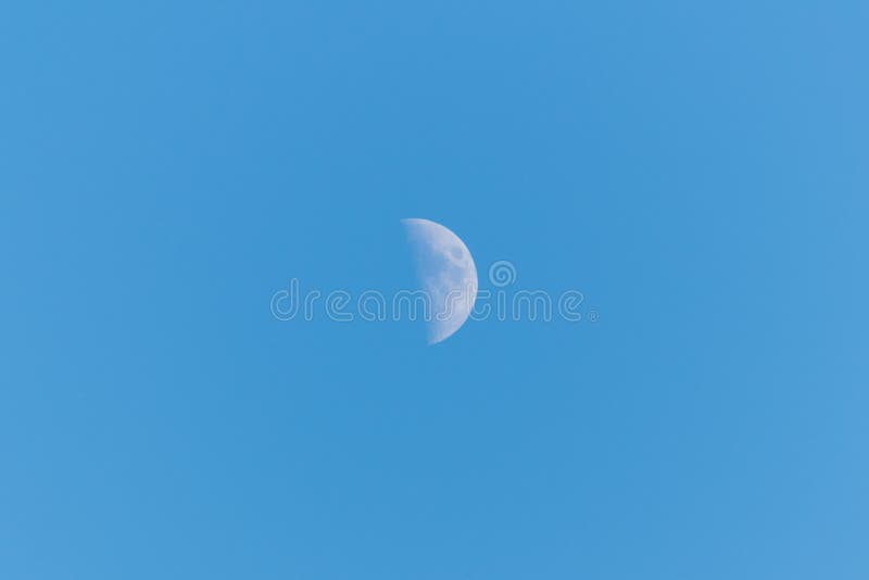 Half Moon on a Clear Blue Sky Stock Photo - Image of daytime, light ...