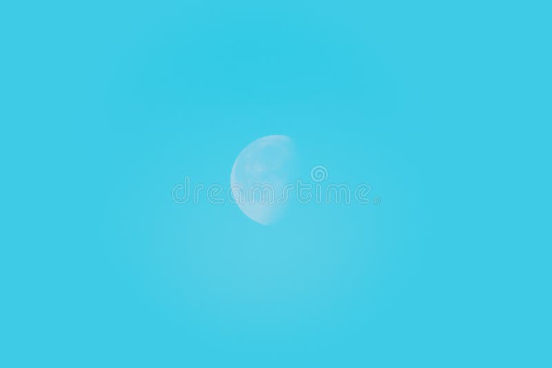 The moon in daylight sky stock photo. Image of colour - 154175294