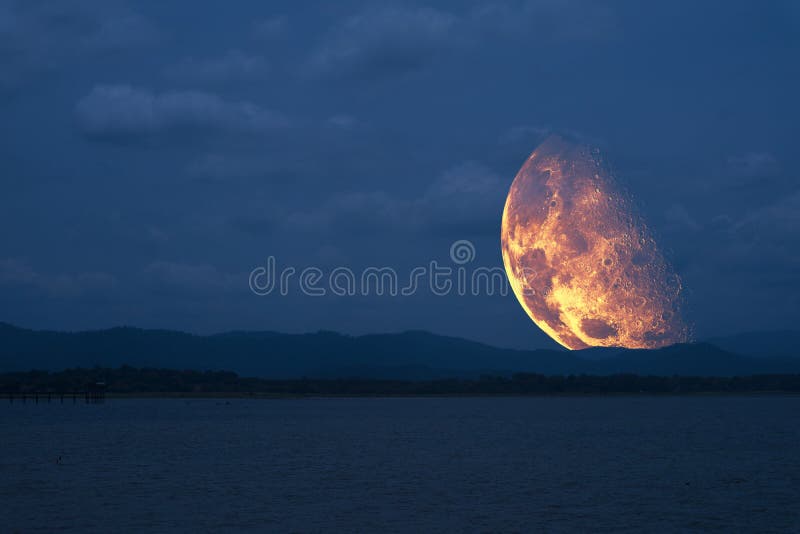 Half Moon Floating in Sky Back on Silhouette Mountain Stock Image ...