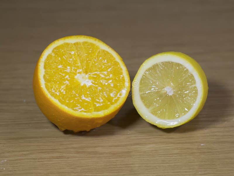 Half an Orange and a Lemon and Spray Stock Image - Image of drop ...