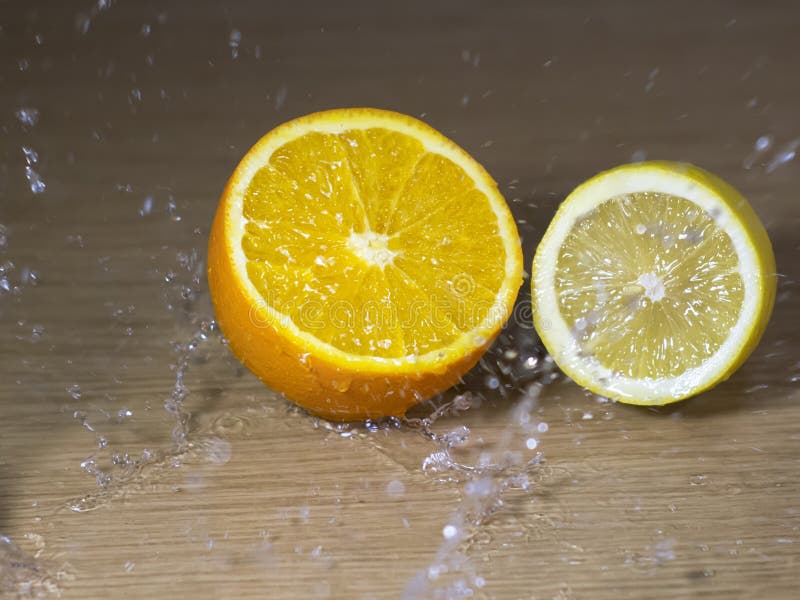 Half an Orange and a Lemon and Water Drops Stock Photo - Image of fresh ...