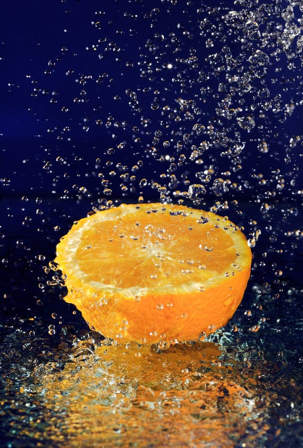 Half of Orange with Stopped Motion Water Drops Stock Photo - Image of ...