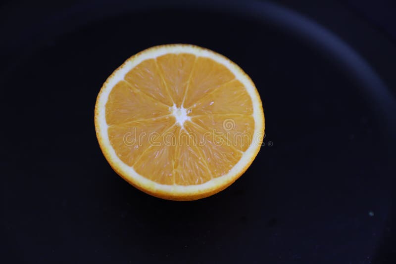 Half Part of an Orange on the Black Background Stock Photo - Image of ...