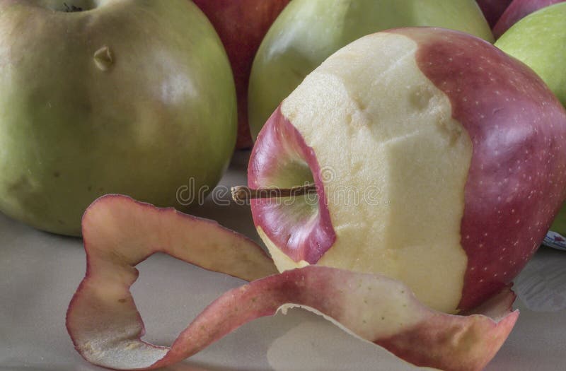 Half peeled apple on plate stock photo. Image of green - 66512998