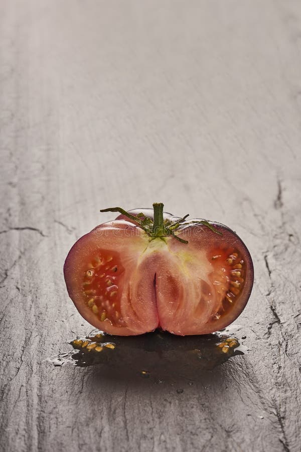 Half Raf Ripe Tomatoes on Black Slate Stock Image - Image of organic ...