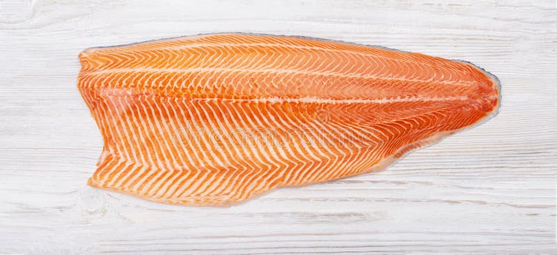 Half Raw Salmon Fillet on Wooden Table Stock Image - Image of dinner ...