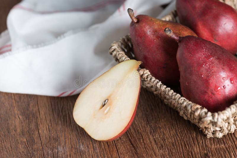 Half of Red Pear and Red Pear in Basket. Stock Image - Image of ...