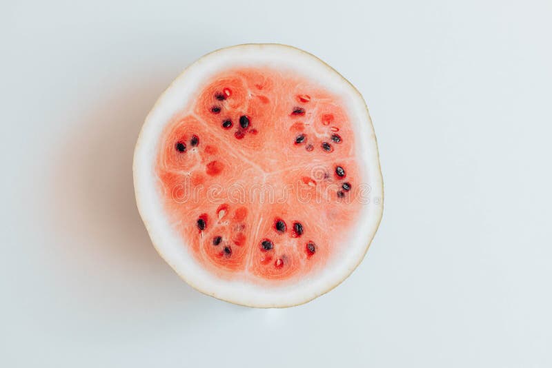 Half Ripe Watermelon with Caps on White Table Stock Image - Image of ...