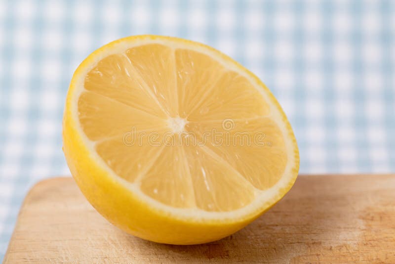 Half of Sliced Lemon on Wood Cutting Board Stock Image - Image of ...