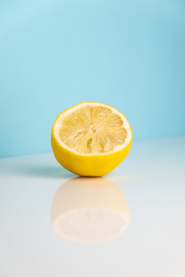 Half of Squezzed Lemon on White Table. Minimalistic Image of Yellow ...