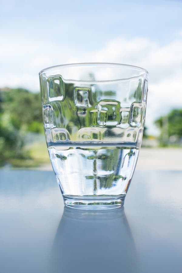 A Half of Water in the Glass Stock Image - Image of drinks, water: 80204615