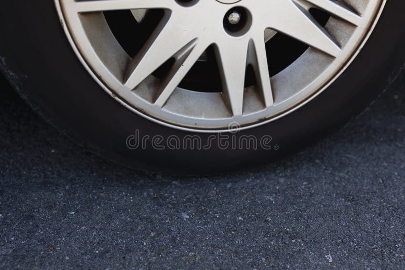 Half the Wheel, Standing on the Asphalt. Stock Image - Image of ...