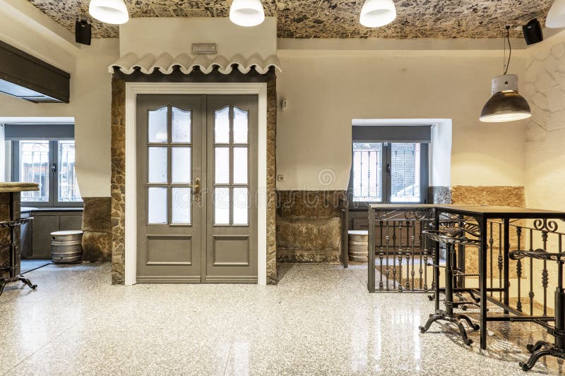 Hall of an Empty Restaurant with Gray Glass Doors and Polished Granite ...
