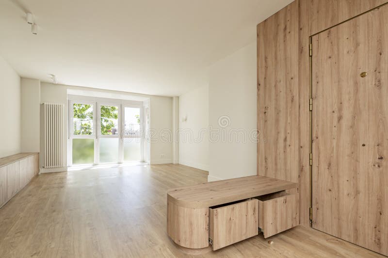 A Hall of an Open Style Home with a Wooden Seat with a Drawer Stock ...