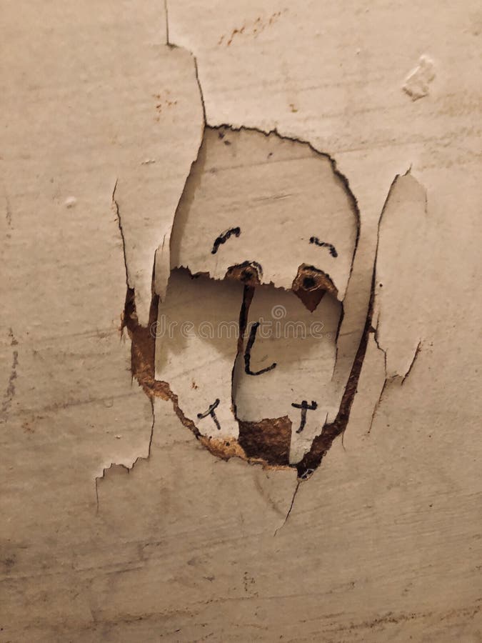 Things with Faces, a Hole Int he Wall Shaped Like Egg Head. Stock Photo ...