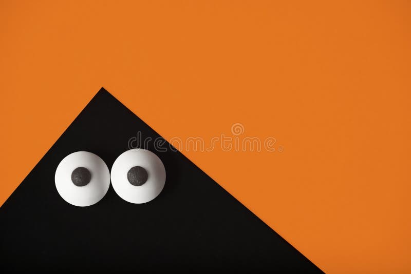 Halloween Background, Orange Ghost with Bulging Eyes on a Black Stock ...