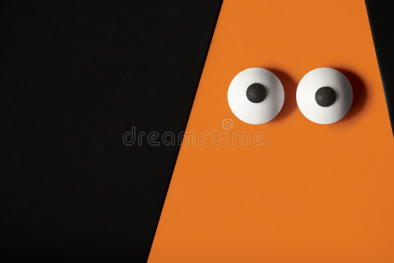 Halloween Background, Orange Ghost with Bulging Eyes on a Black Stock ...