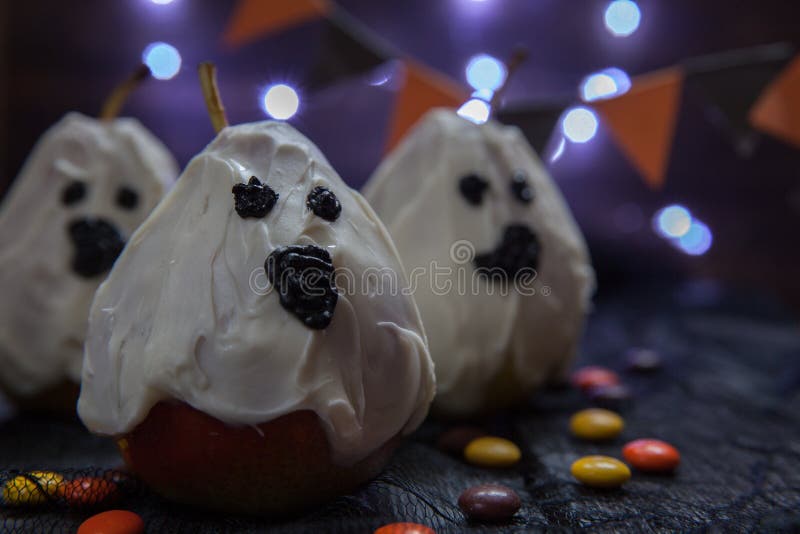 Halloween Candy Pears or White Chocolate Ghosts on a Stick Stock Image ...